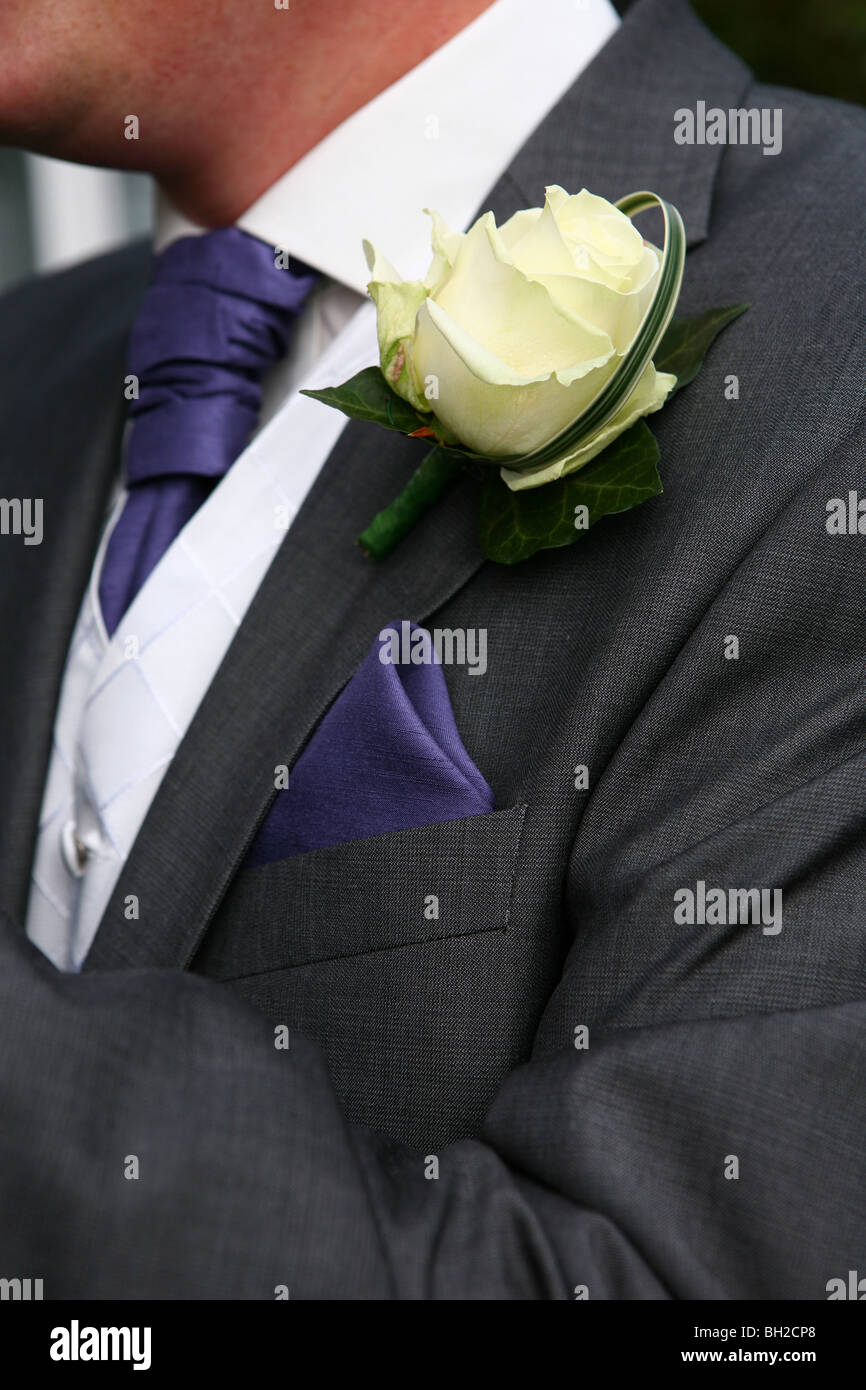Close up of a grooms buttonhole and pocket handkerchief/Pocket Square ...