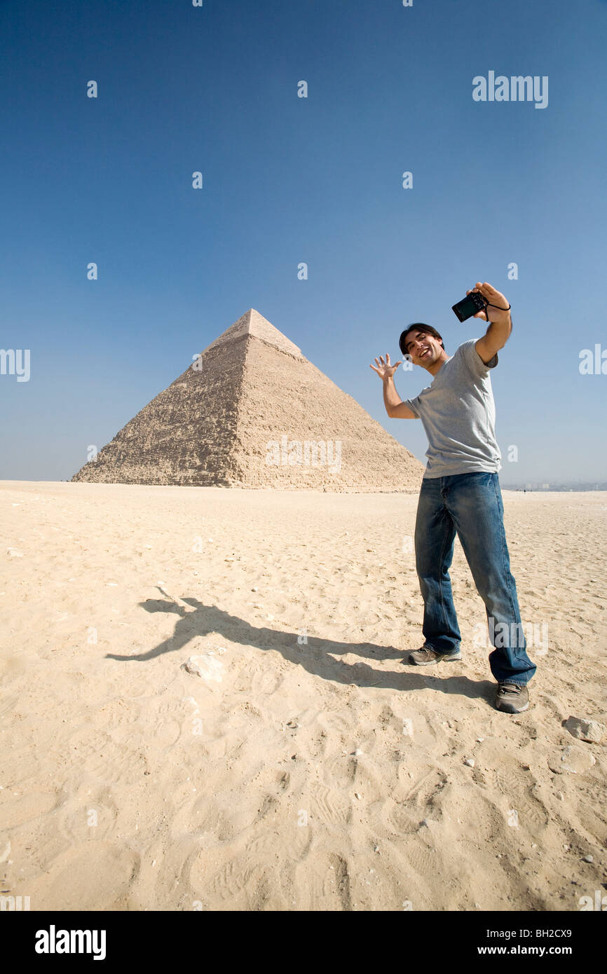 Man taking a picture of himself with Pyramid in background Stock Photo ...