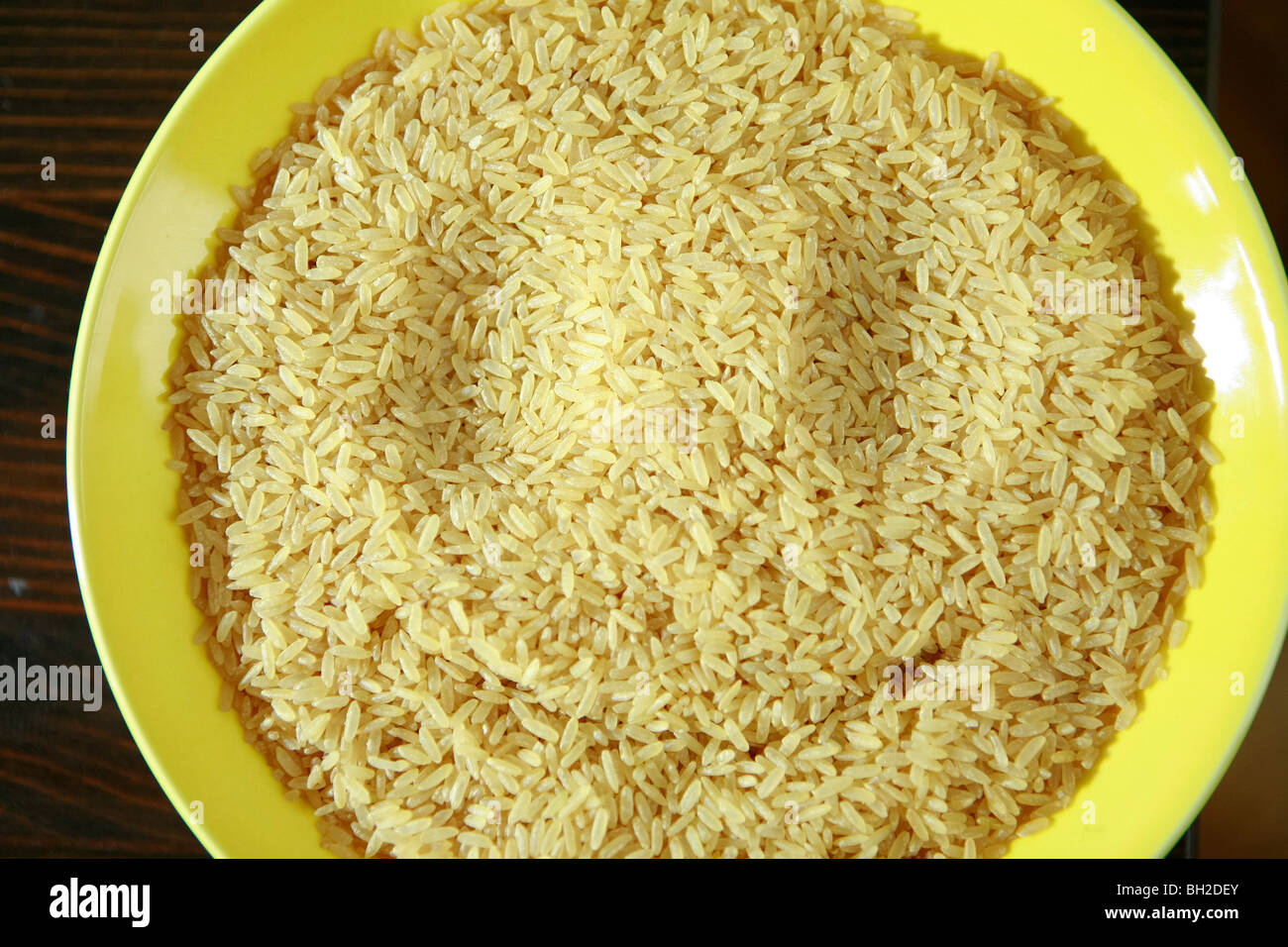 Yellow plate filled with brown rice displays a happy smiley face Stock ...