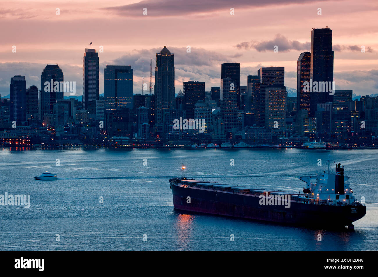 A beautiful sunrise greets the city of Seattle. Ships and ferries are ...