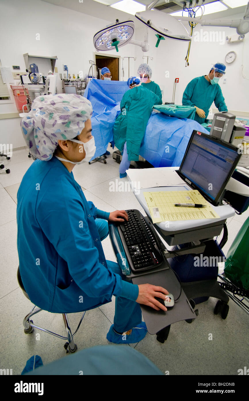 At a computer during an operation at a Southern California hospital, an ...