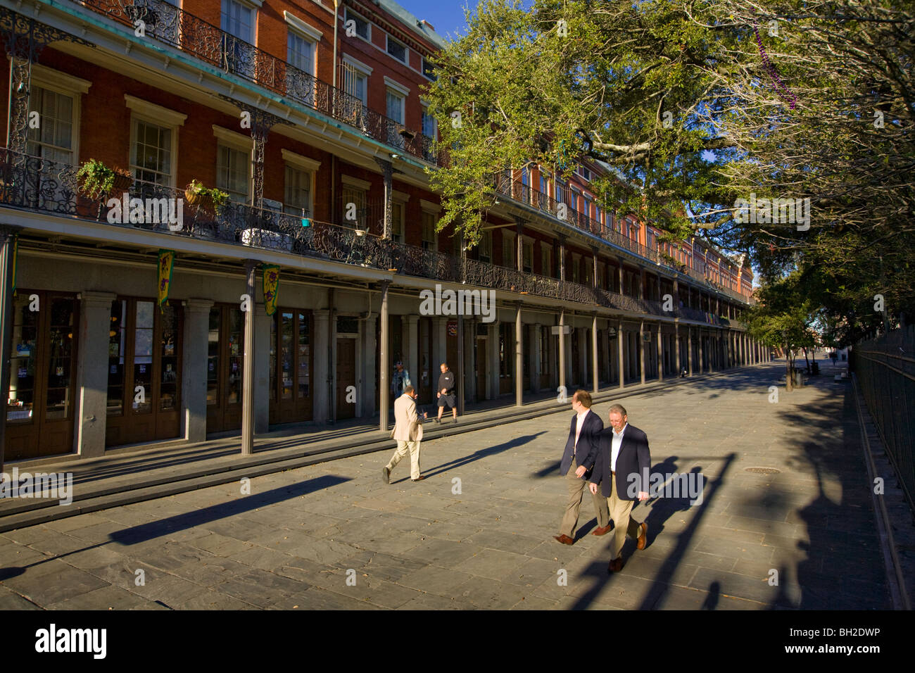 People walking early morning by Upper Pontalba Building French Quarter ...