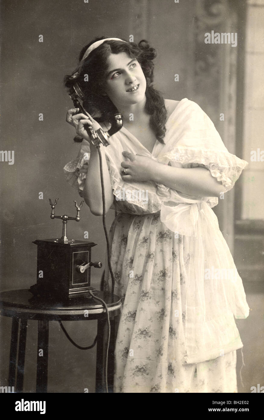 Edwardian Lady on Candlestick Telephone Stock Photo - Alamy