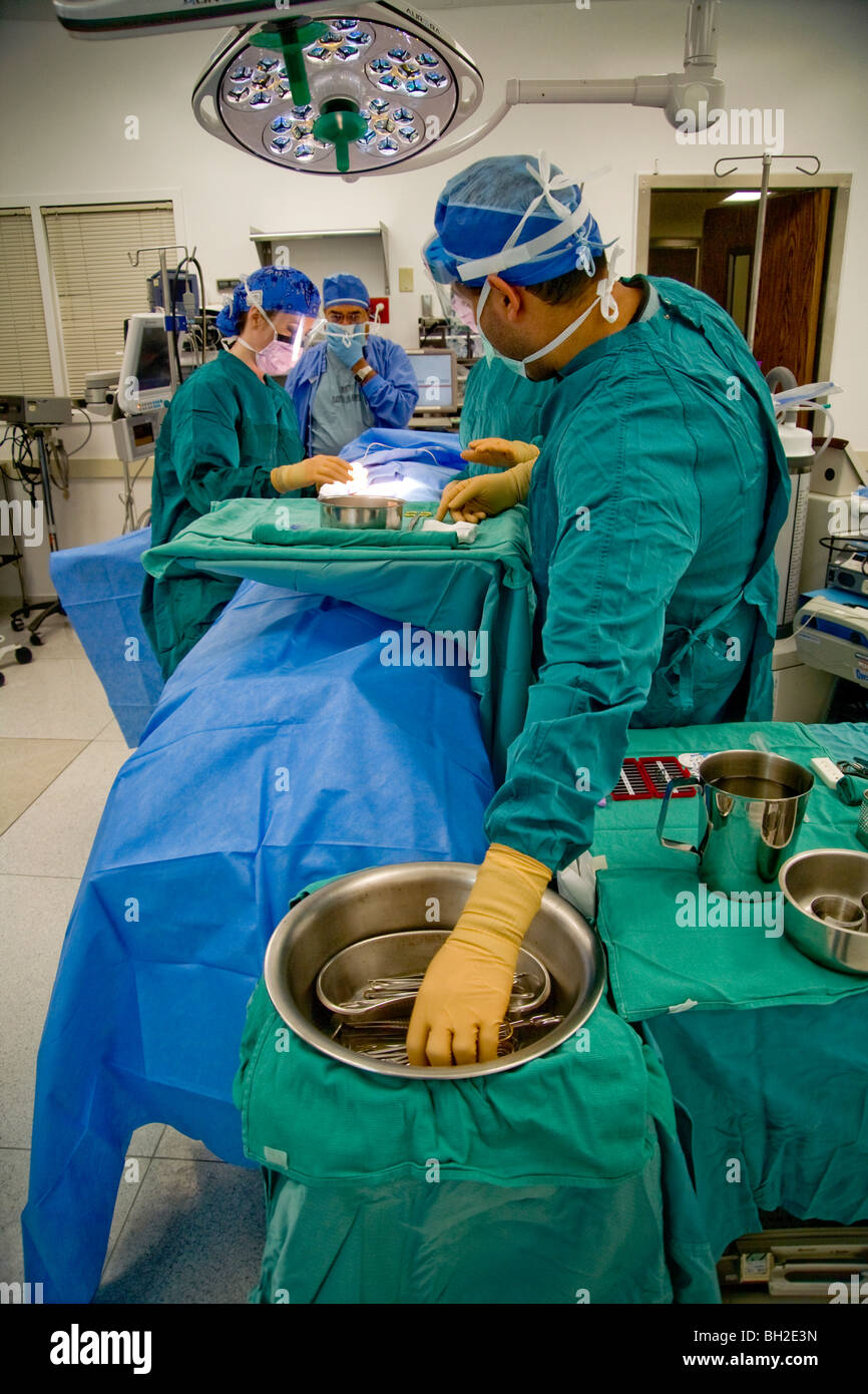 As an operation at a Southern California hospital concludes, a scrub ...