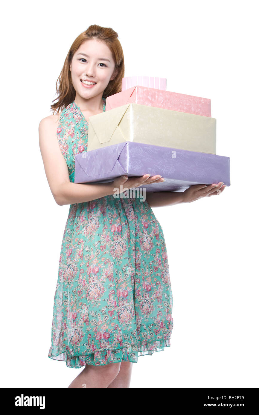 Young woman holding gift boxes Stock Photo - Alamy