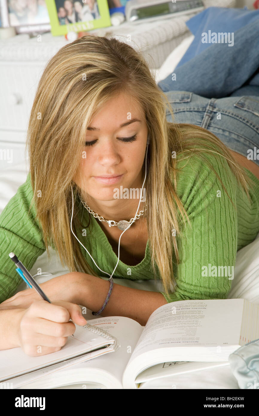 Caucasian teenage girl working on homework Stock Photo - Alamy