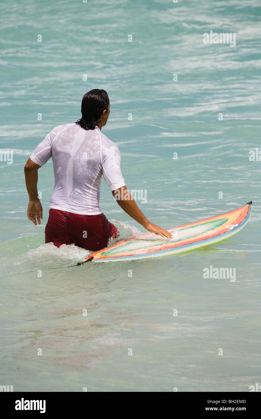 Brazilian man surfing on Copacabana Beach in Rio de Janeiro in Brazil ...