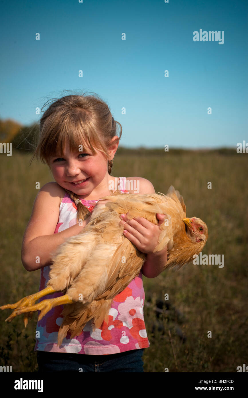 Five Year Old Girl Holding Heritage Breed Of Free Range Chicken ...