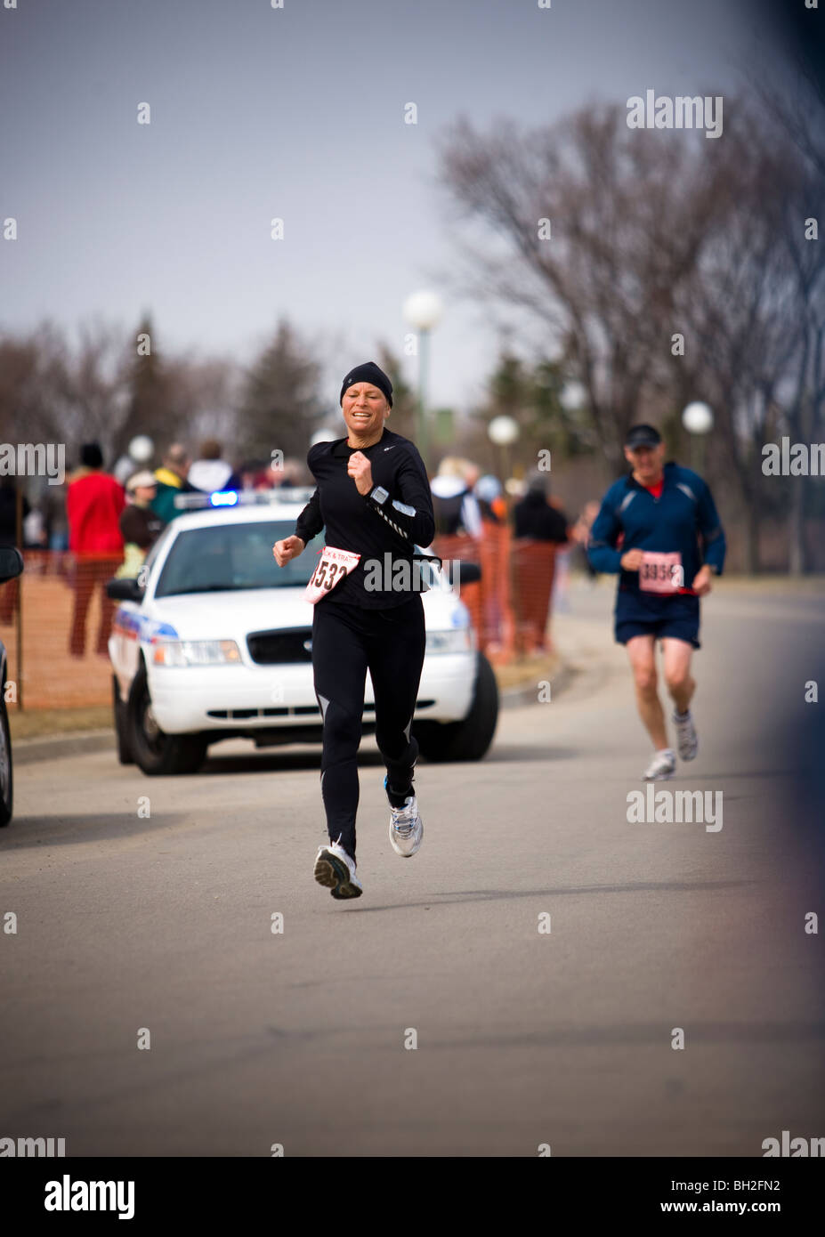 Middle aged female runner in marathon, Regina, Saskatchewan Stock Photo ...