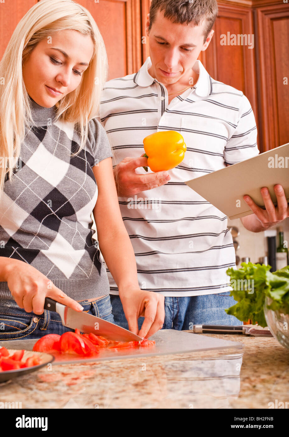 Happy woman dicing food hi-res stock photography and images - Alamy