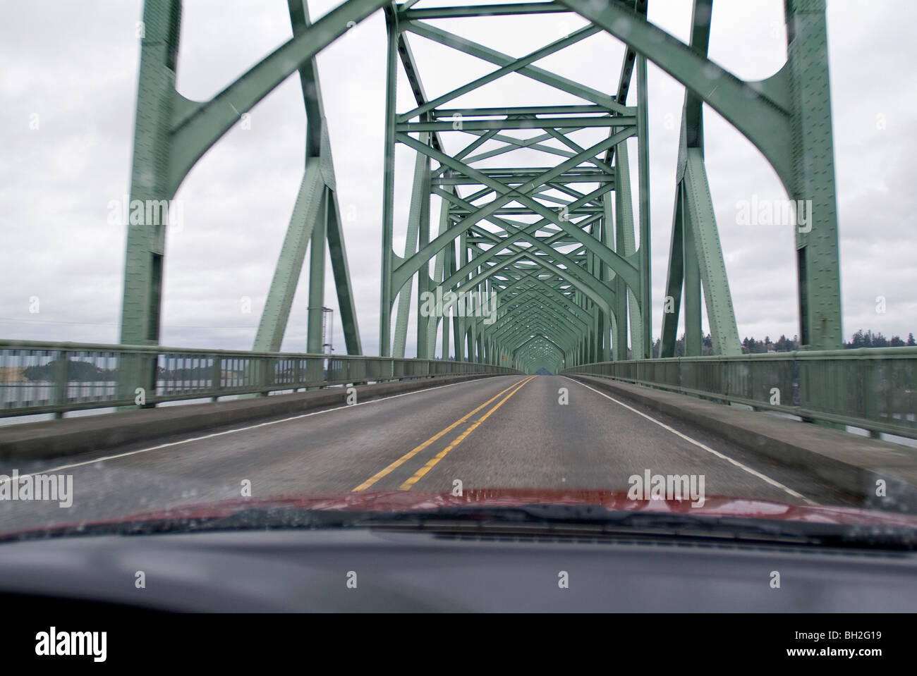 Car crossing empty bridge Stock Photo - Alamy