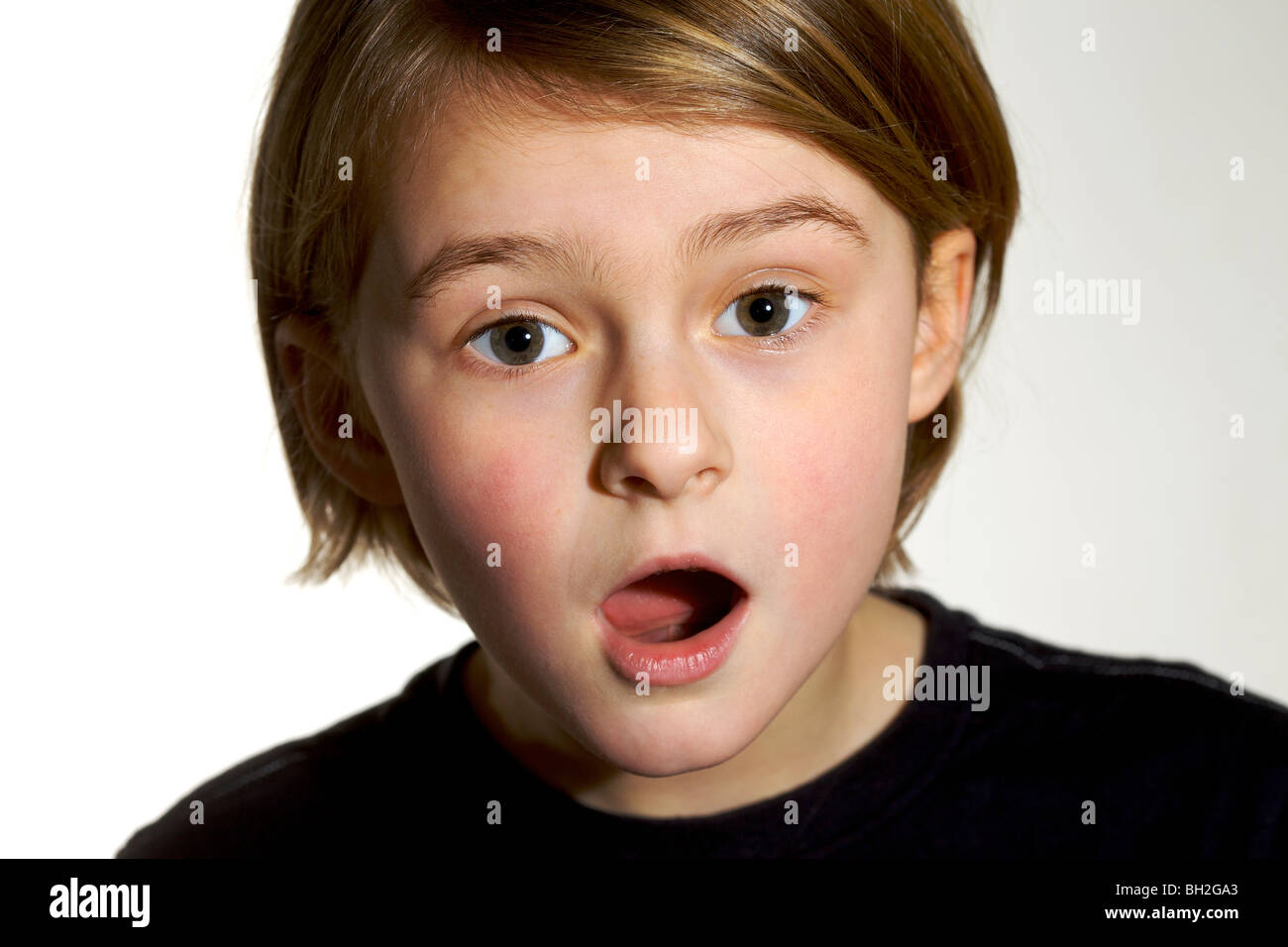 Young girl shouting screaming shocked alarmed scared surprised ...