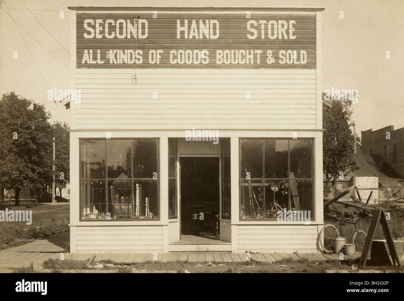 Second Hand Store with Merchandise in Windows Stock Photo - Alamy