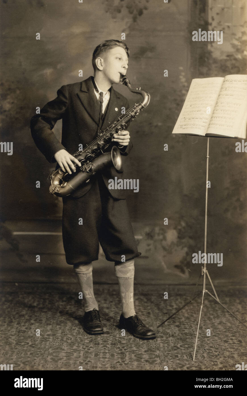 Boy practicing saxophone hi-res stock photography and images - Alamy