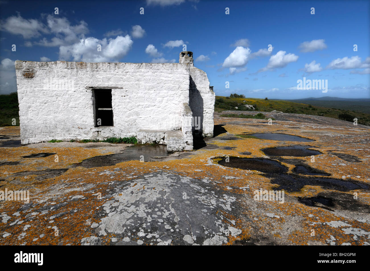 white painted stone built look out hut top rocky outcrop seeberg view ...