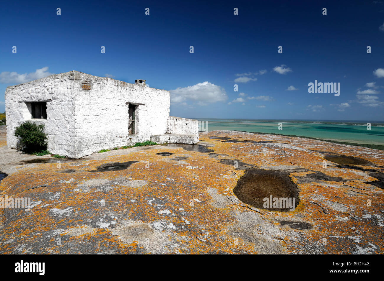 white painted stone built look out hut top rocky outcrop seeberg view ...