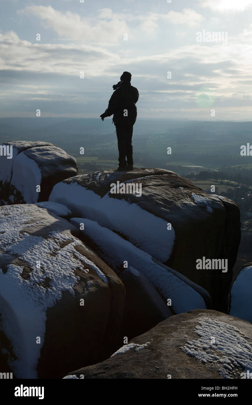 Single person standing on on Curbar edge in the Peak District National ...