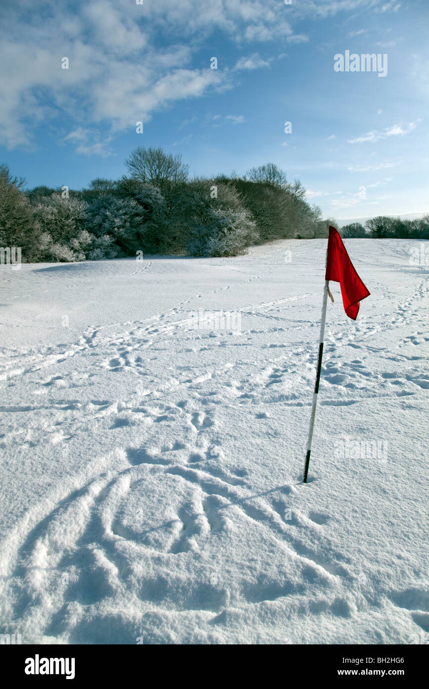 Golf flag on snow covered golf course Chesterfield Derbyshire England ...
