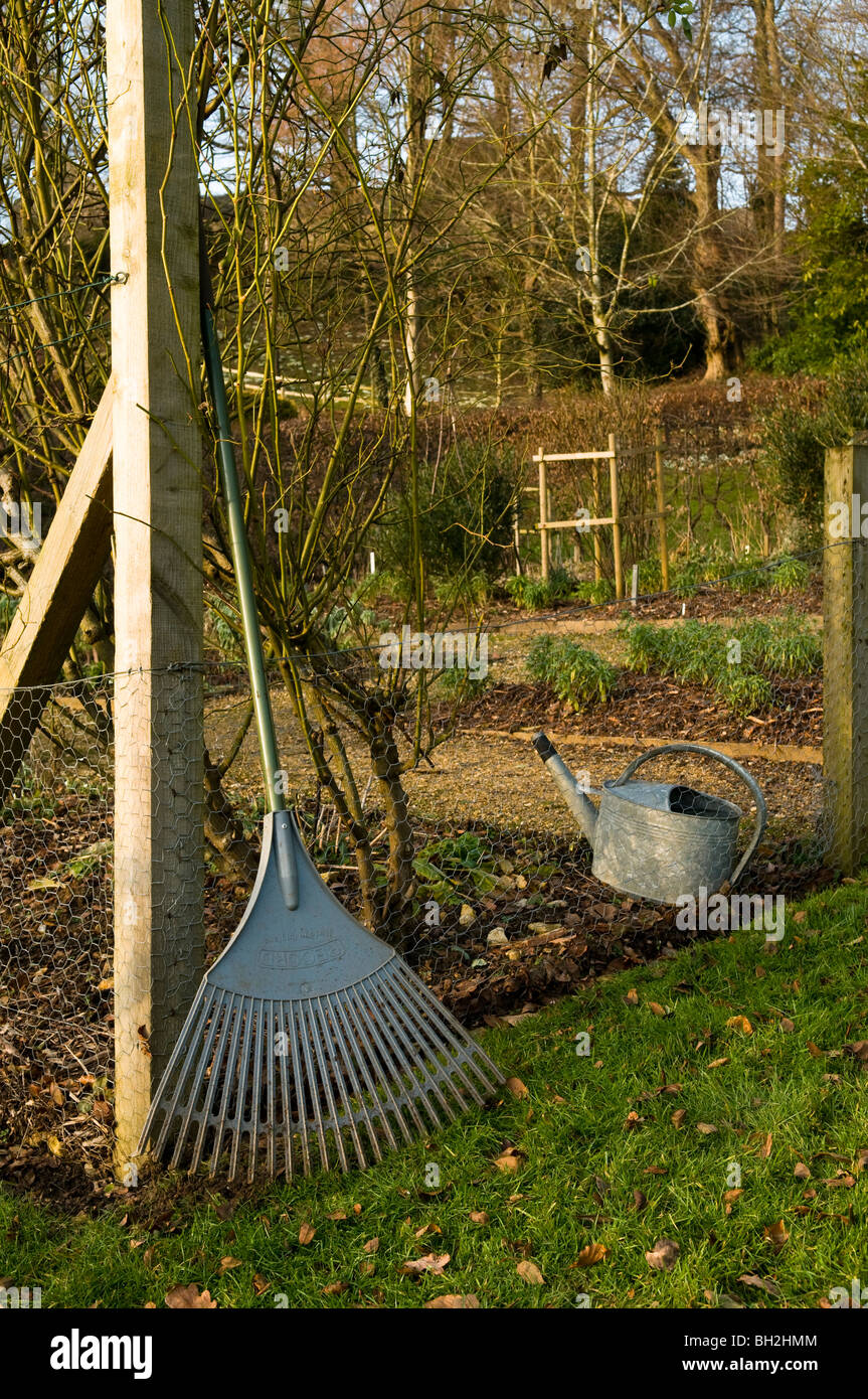 Rake propped up against a fence at Painswick Rococo Garden in The ...