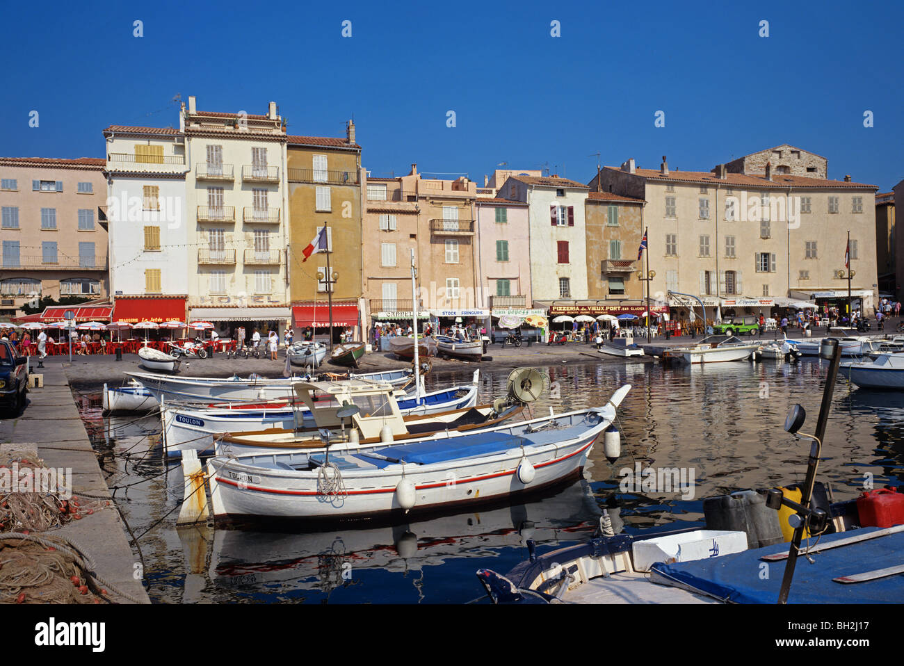 Harbourside scene in the famous resort of St Tropez on the French ...