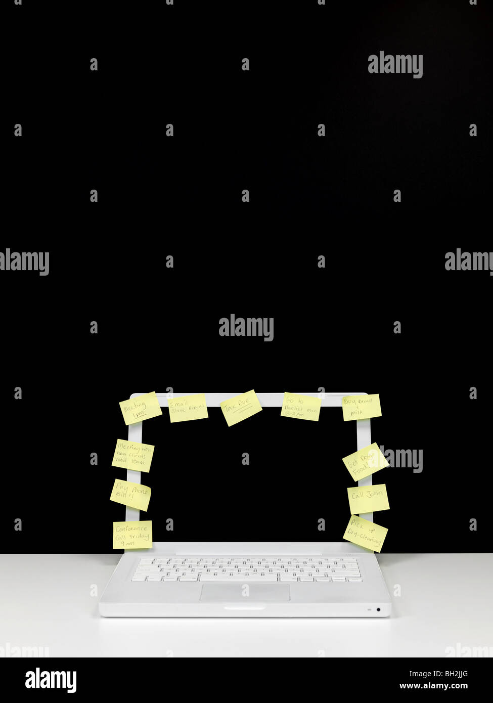 A contemporary workplace office desk with a black background Stock ...