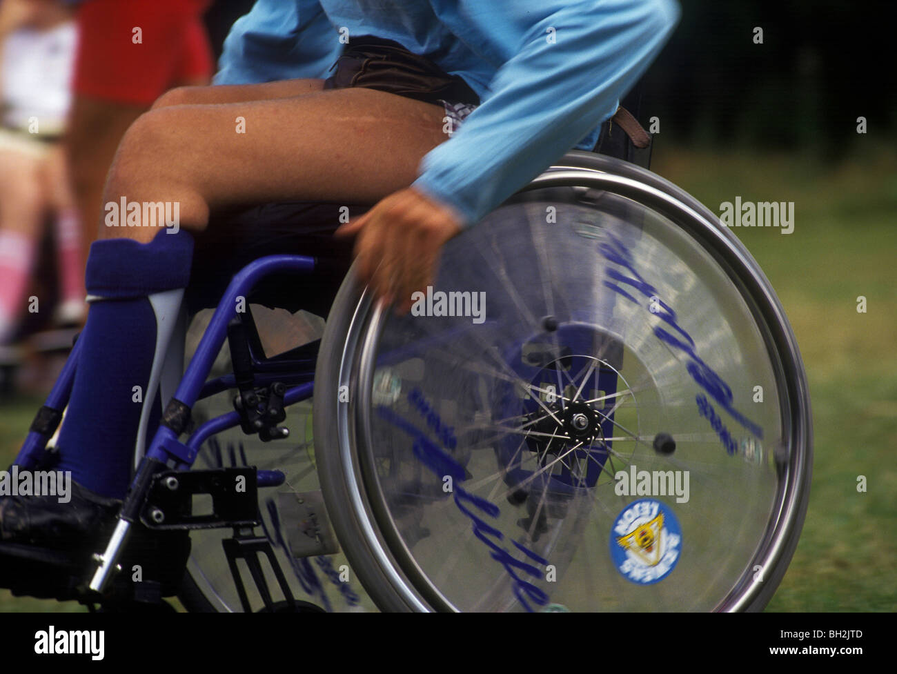 Wheelchair in motion Stock Photo - Alamy