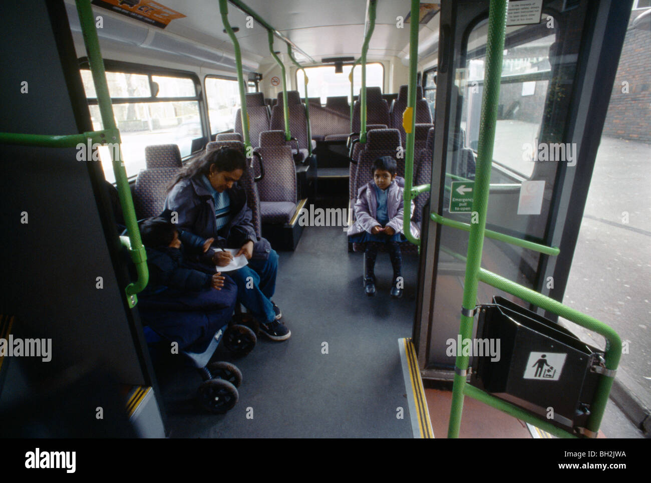 Children With Mother Travelling On A City Bus Stock Photo - Alamy