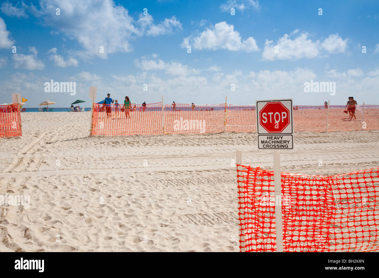 Heavy Machinery crossing on the beach of Cancun hotel zone in Mexico ...