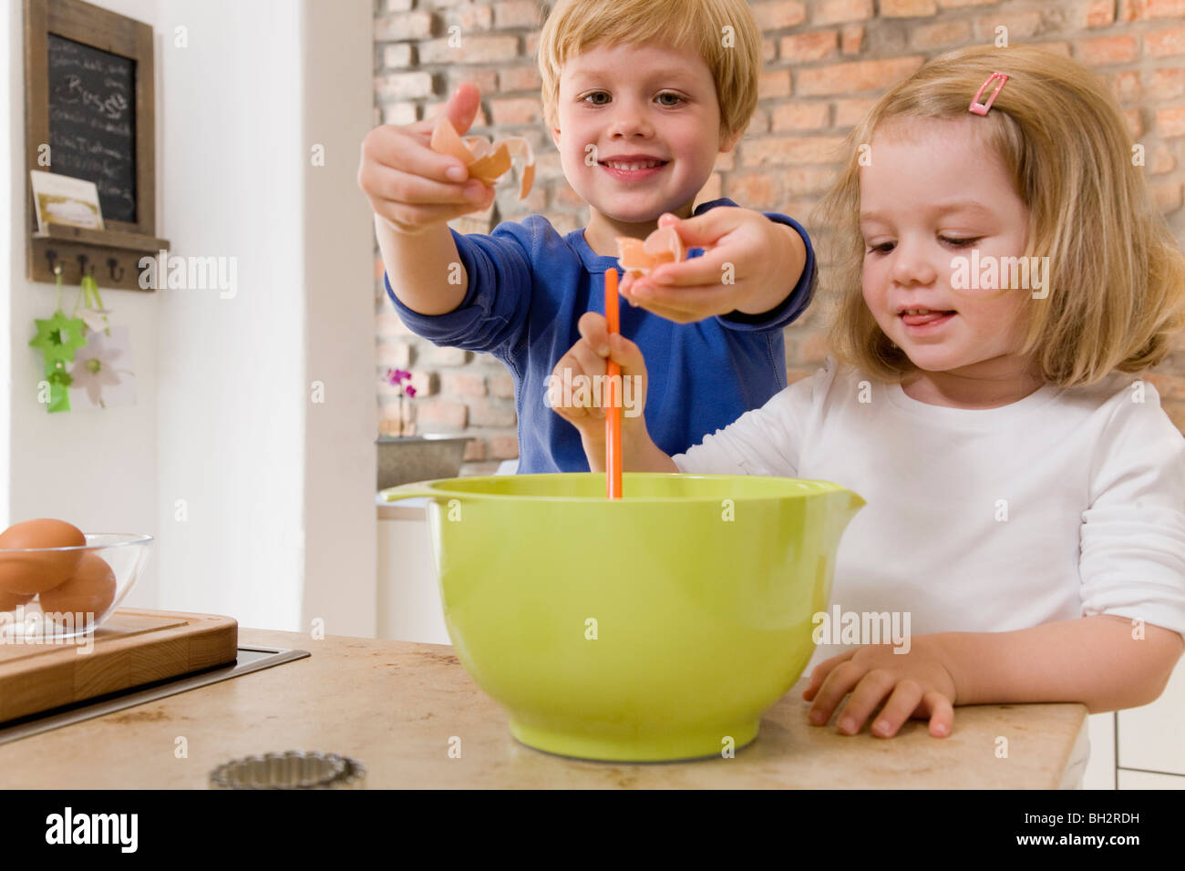 girl and boy mixing ingredients Stock Photo - Alamy