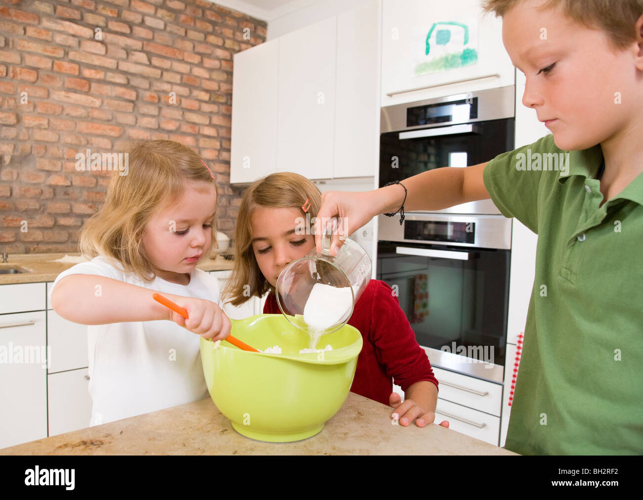 girls and boy mixing ingredients Stock Photo - Alamy