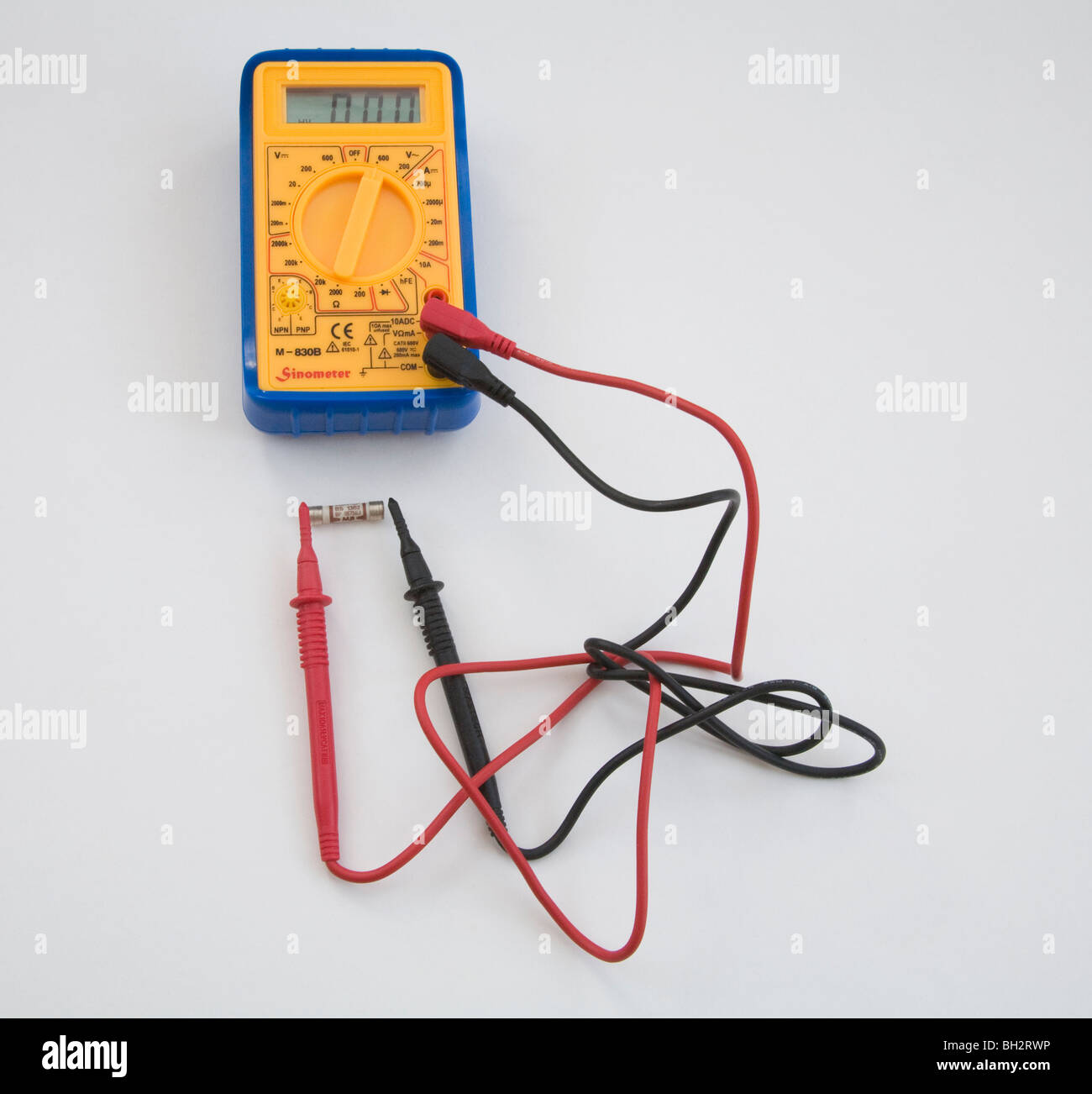 Studio Close up Pocket sized Digital Multimeter checking a 13a Fuse ...