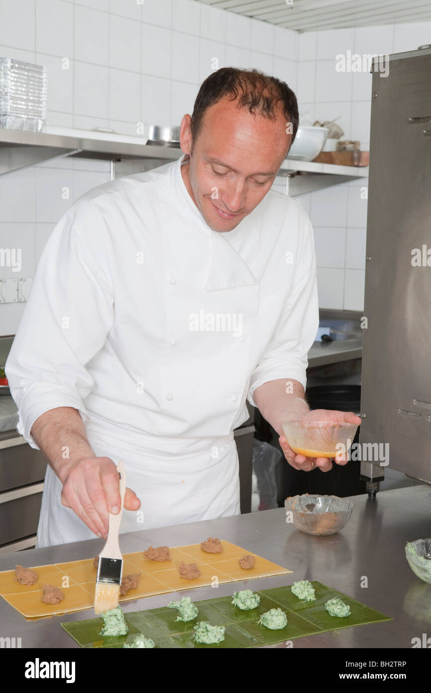 cook filling pasta, concentrated Stock Photo - Alamy