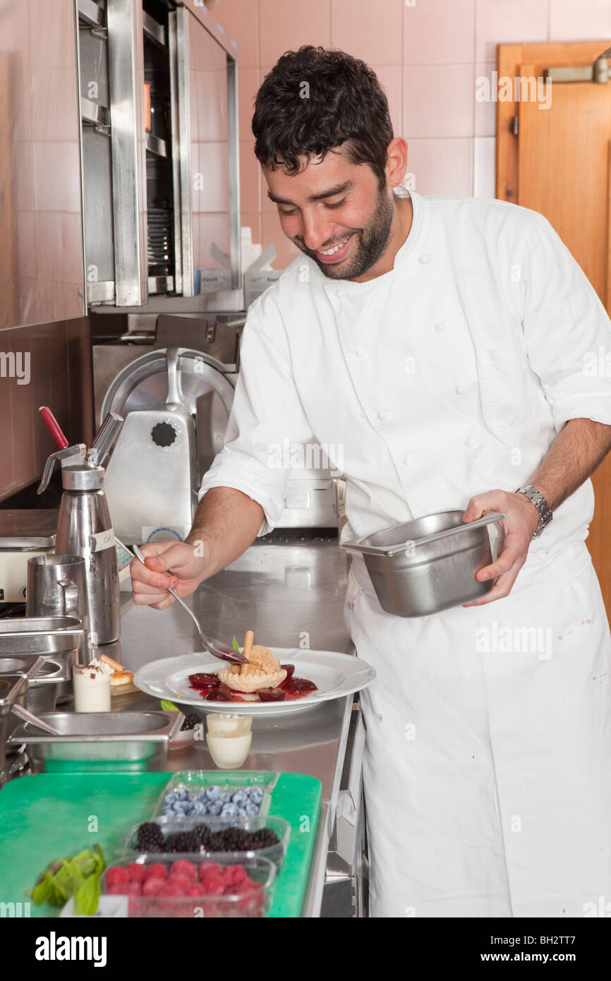 cook preparing plate Stock Photo - Alamy