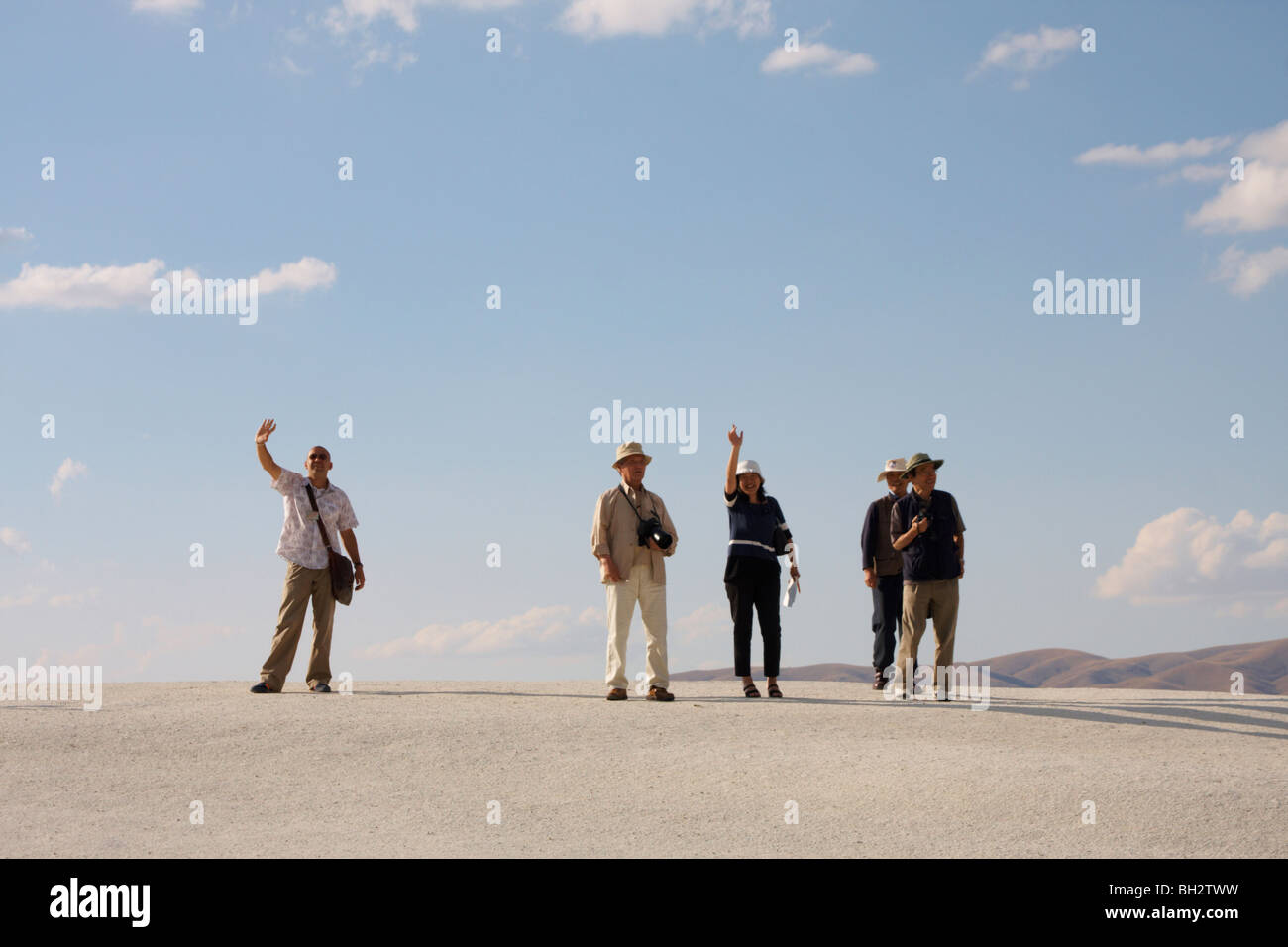 group of people posing for pictures Stock Photo - Alamy