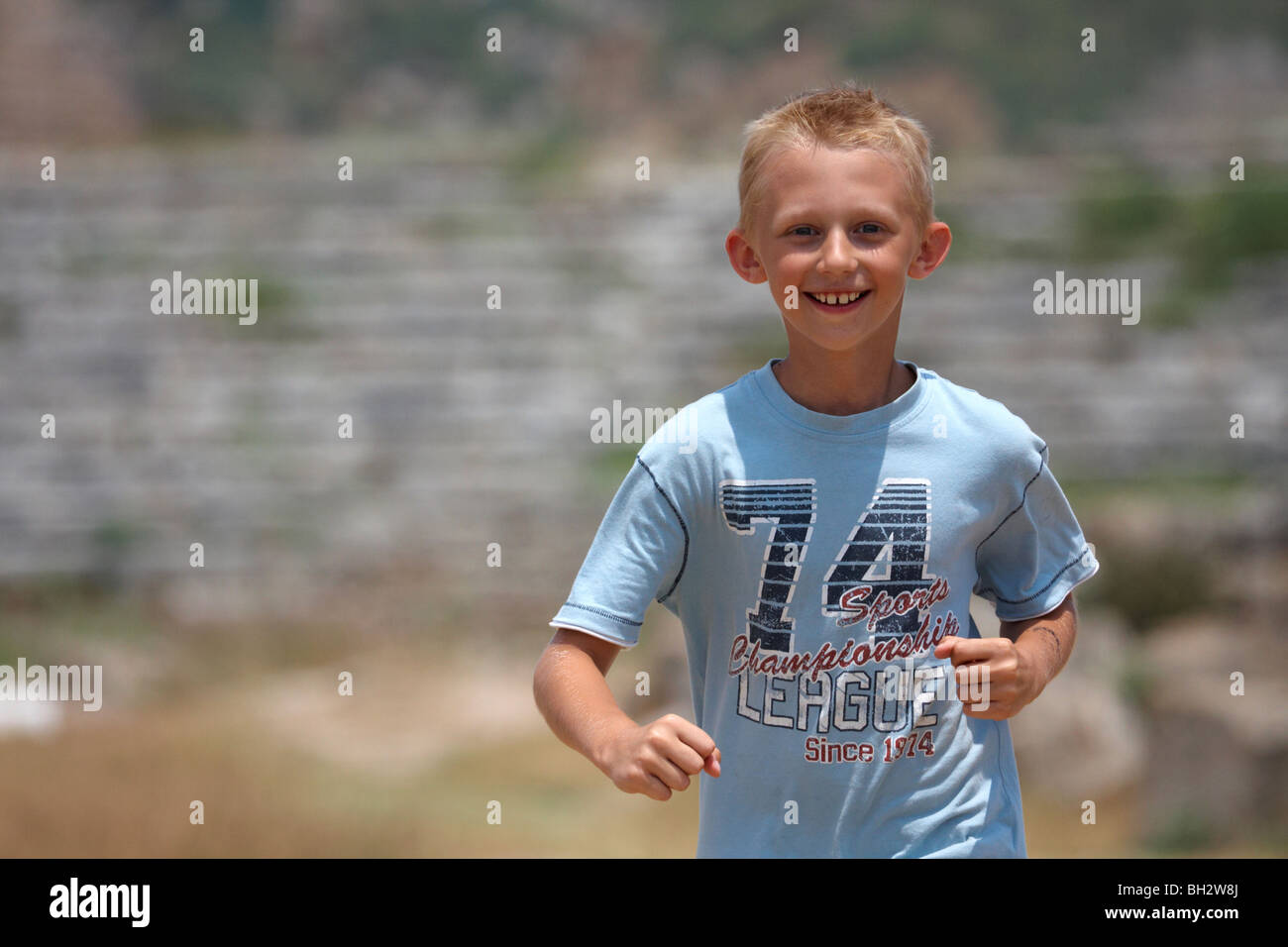 boy running through the ancient stadium Stock Photo - Alamy
