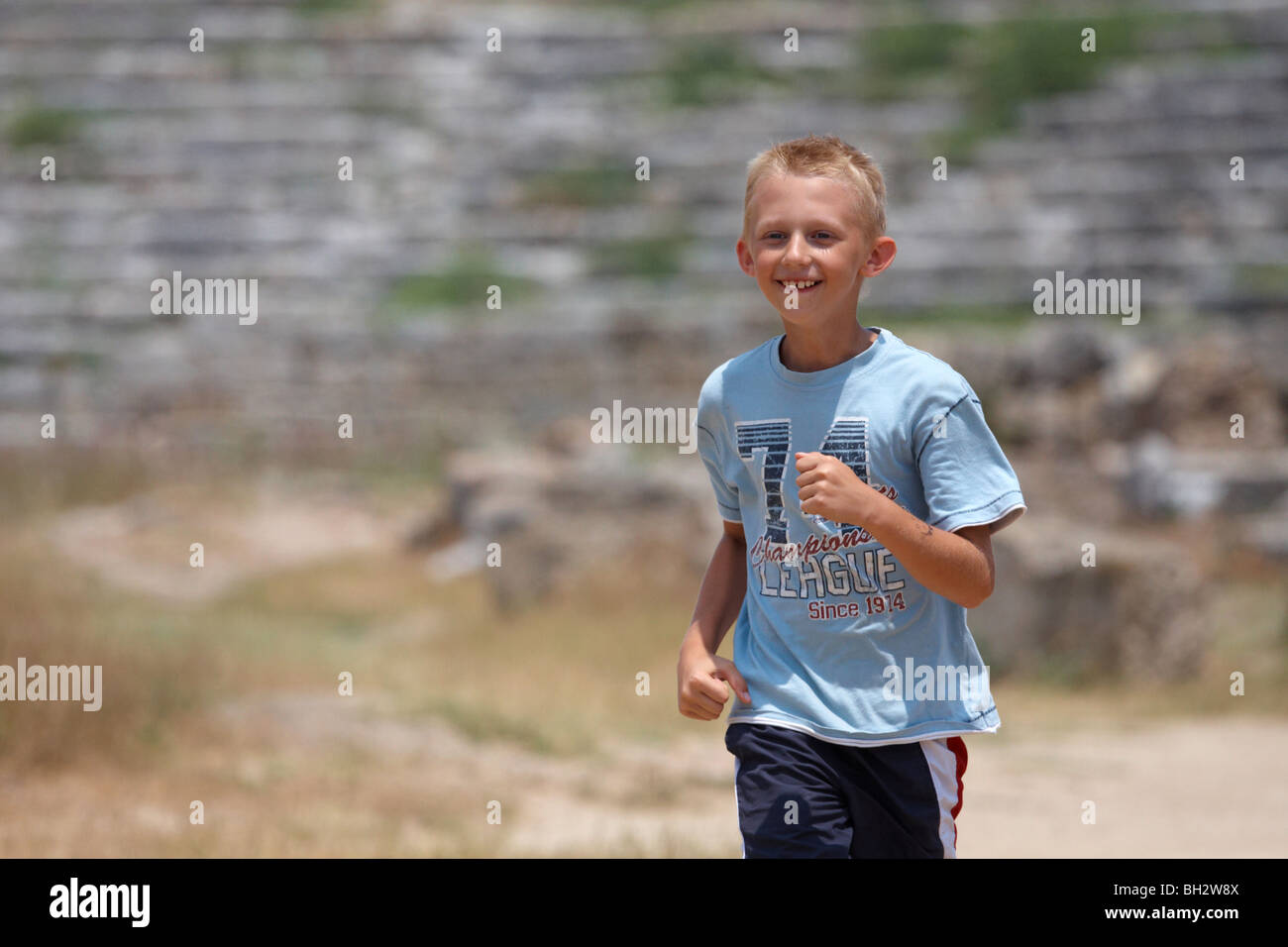 boy running through the ancient stadium Stock Photo - Alamy