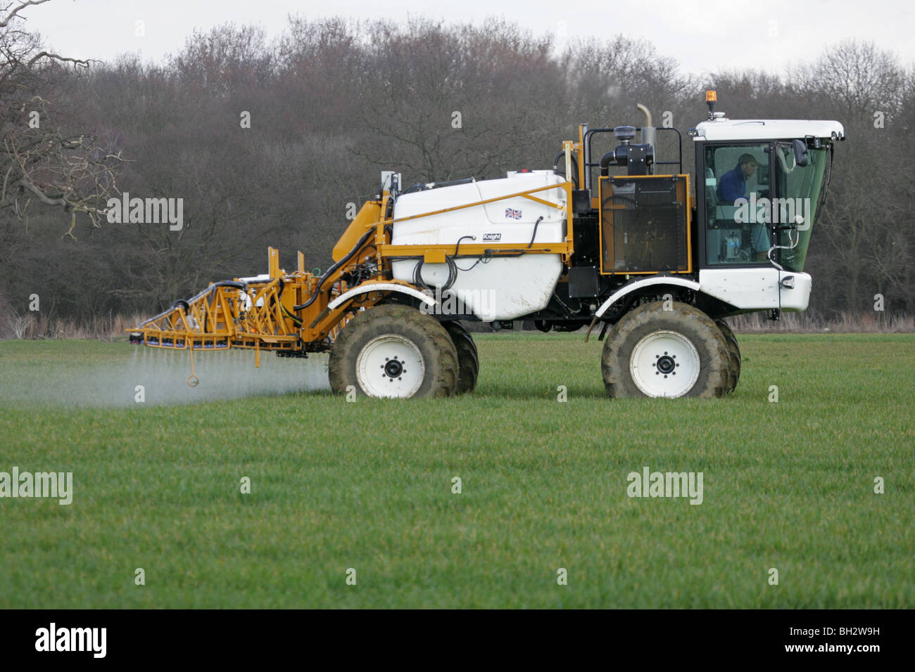 Crop Sprayer spraying wheat Stock Photo - Alamy