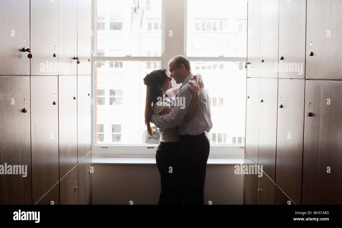 Office workers kissing hi-res stock photography and images - Alamy