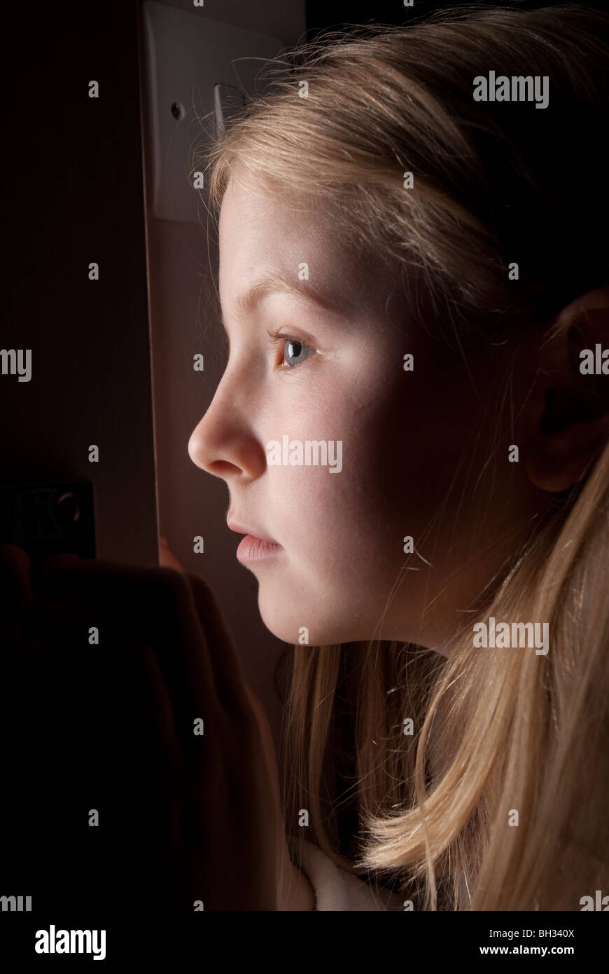 Young girl awakes in her bed at night UK Stock Photo - Alamy