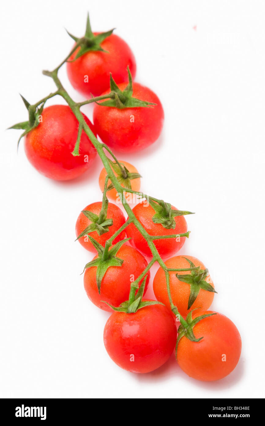 Organic cherry tomatoes over Cut Out Stock Images & Pictures - Alamy