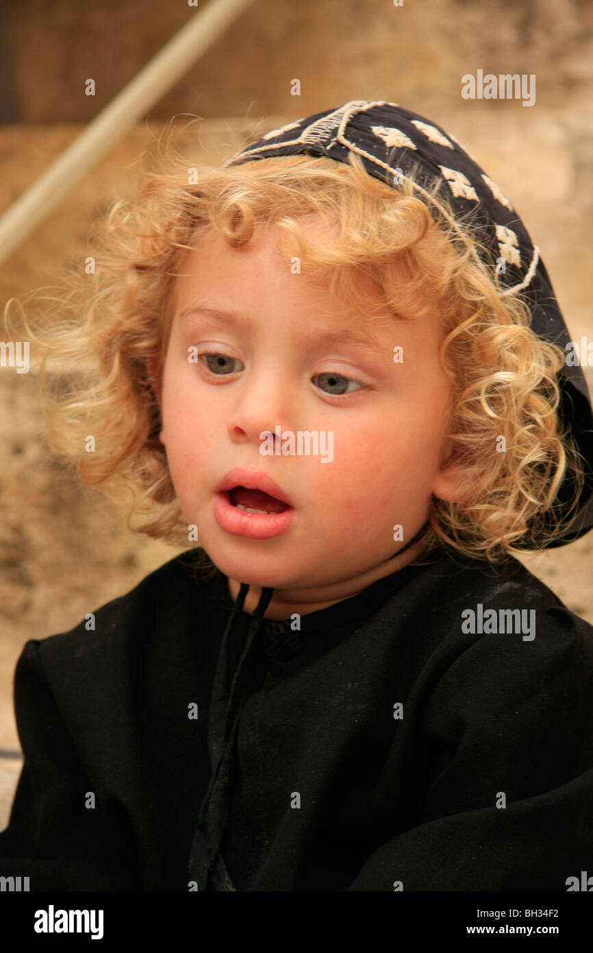 Israel, Jerusalem Old City, a Syrian Orthodox boy at St. Mark's Church ...