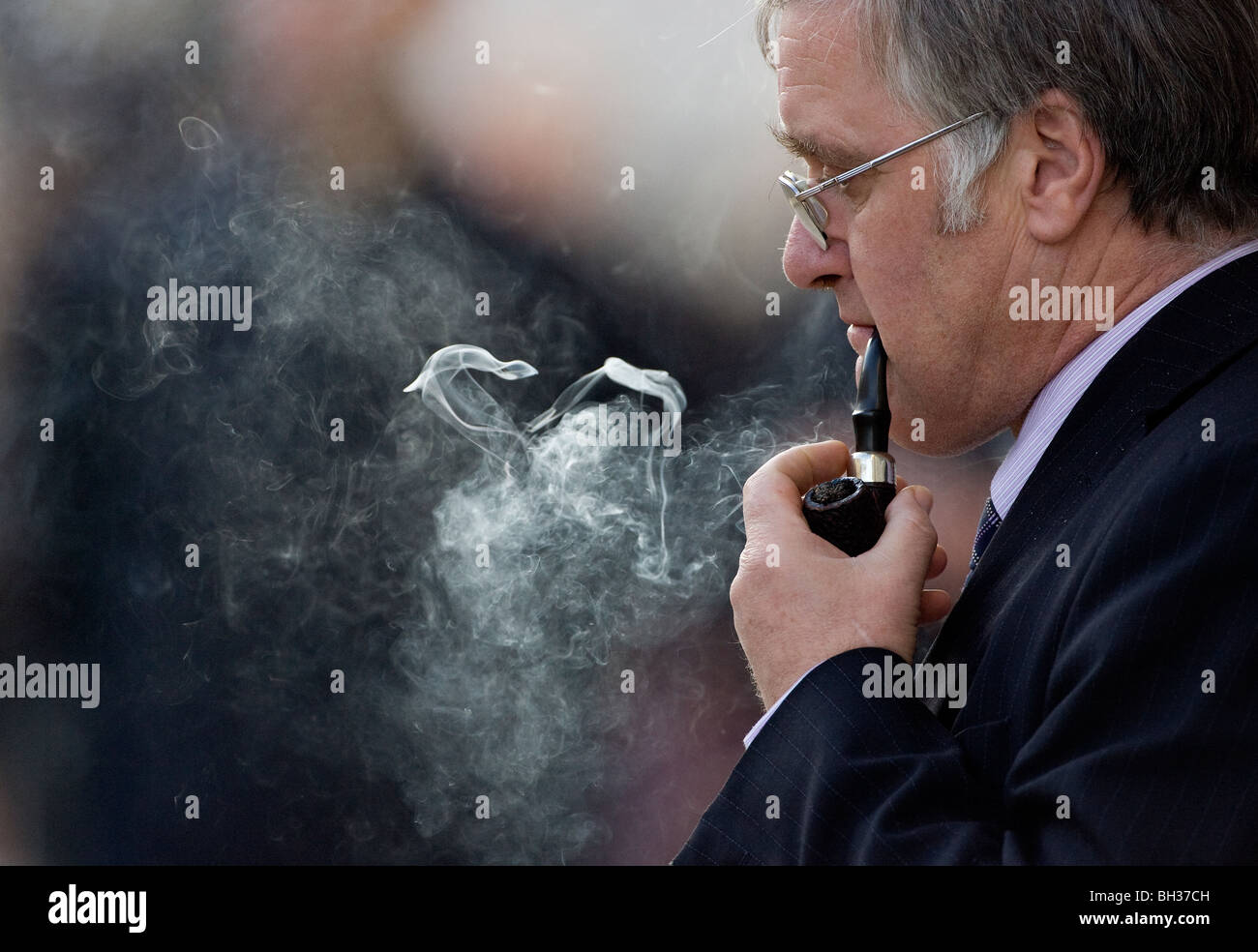 A man smoking a pipe. Picture by James Boardman Stock Photo - Alamy