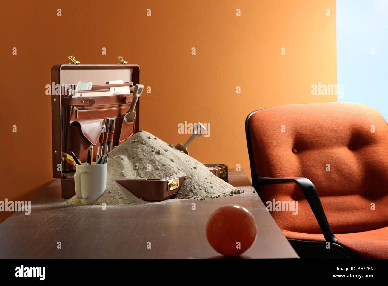 Pile of beach sand on work desk Stock Photo - Alamy
