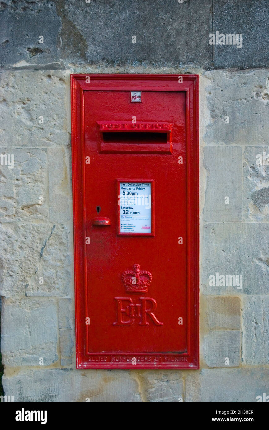 Red british post box in a city street hi-res stock photography and ...
