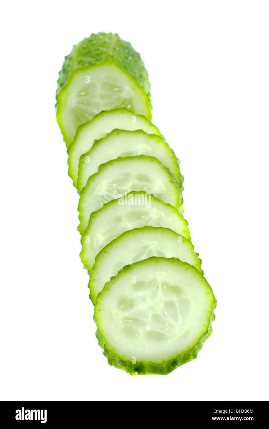 cucumber cut by segments. Isolation on white Stock Photo - Alamy