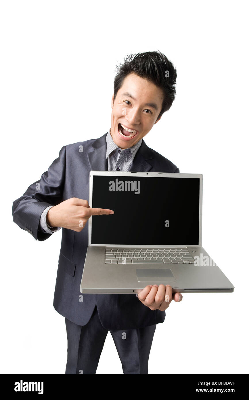 Businessman showing computer Stock Photo - Alamy