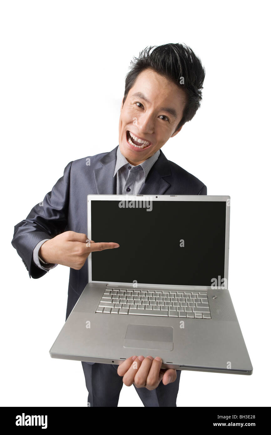 Businessman showing computer Stock Photo - Alamy