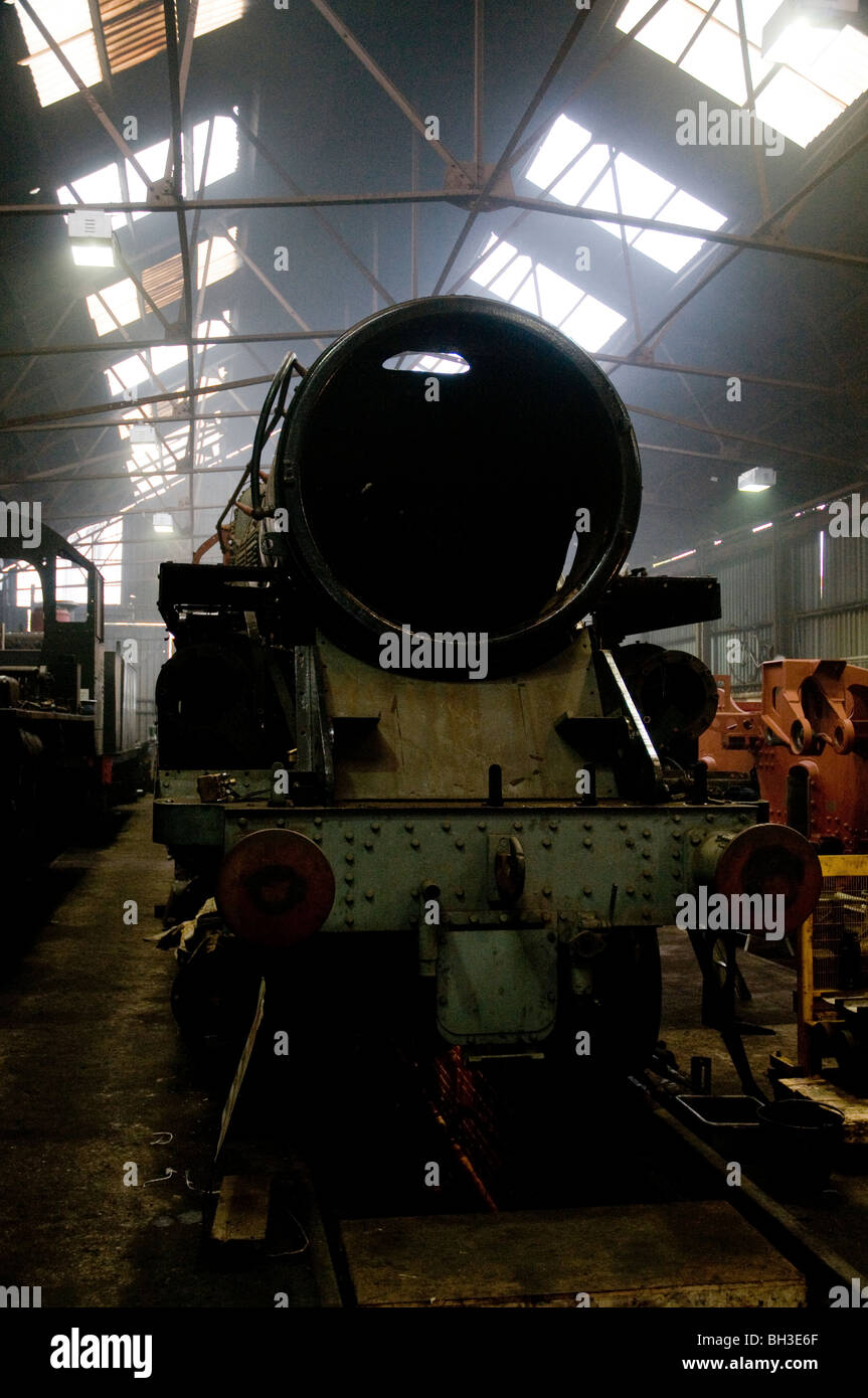 steam engine under repair in the great central railway steam shed ...