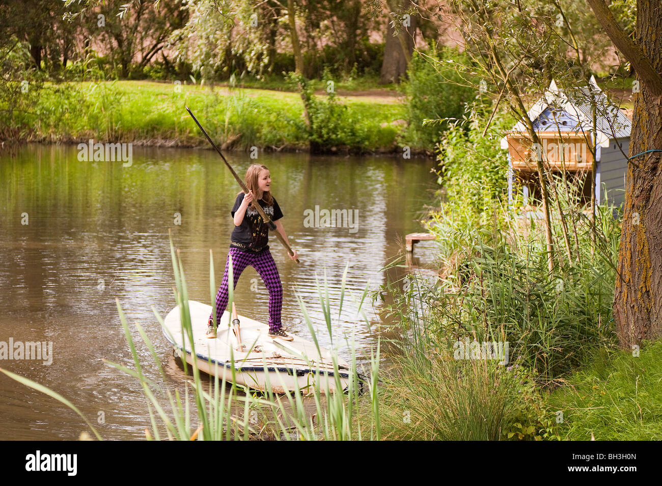 Girl Playing on boat on Duck Pond Stock Photo - Alamy