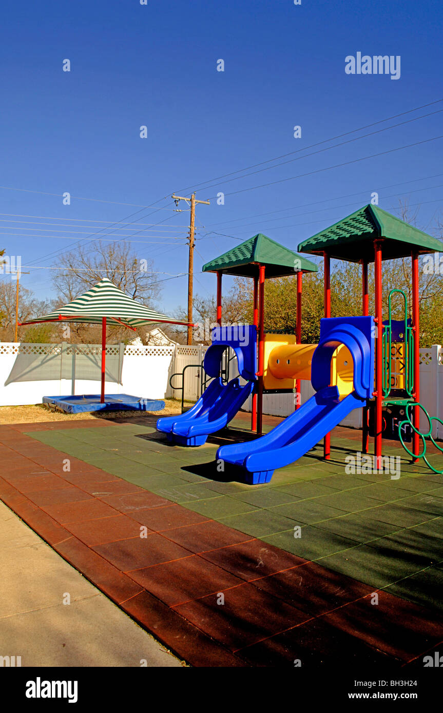 A secure but deserted playground with modern safe equipment meets the ...